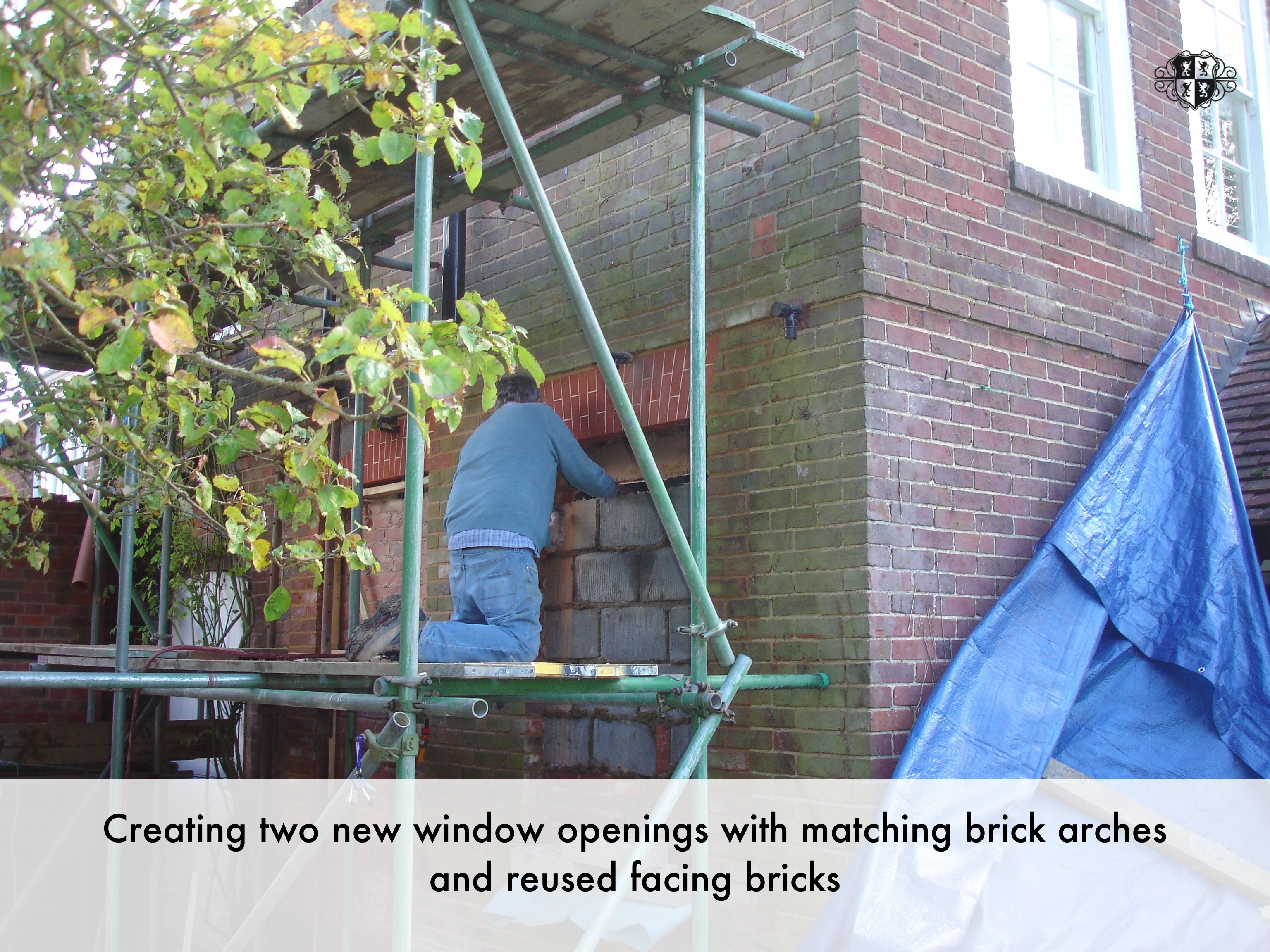 Creating two new window openings with matching brick arches and reused ...